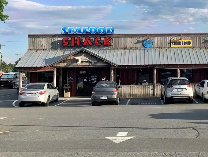 The wooden exterior of Walkertown Seafood Shack stands like a beacon of fried goodness, promising seafood treasures within those rustic walls.
