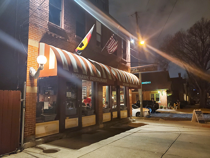 That iconic striped awning isn't just a canopy&mdash;it's a beacon for hungry souls wandering German Village after dark. Comfort food salvation awaits.