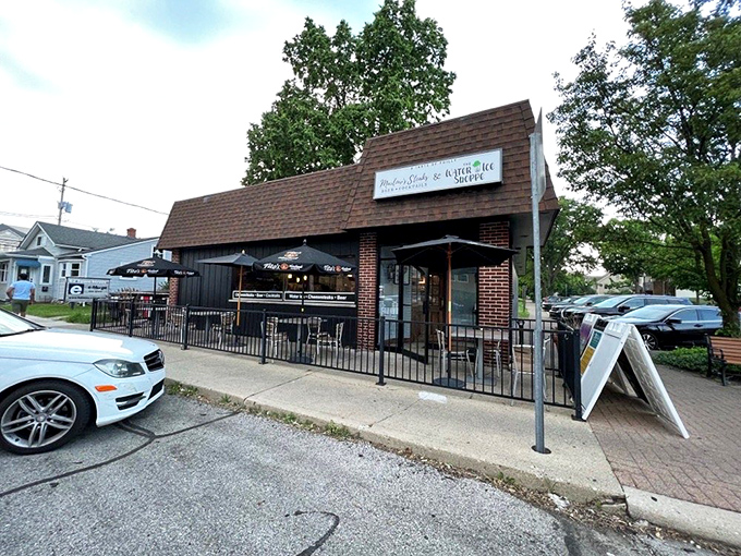 Marlow's unassuming exterior might not stop traffic, but that brown-shingled roof shelters cheesesteak paradise. Those patio umbrellas hint at the treasures waiting inside.