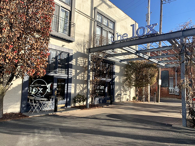 The sleek exterior of The Lox Bagel Shop beckons like a modern-day siren song for carb enthusiasts. That metal awning? Pure architectural foreplay.