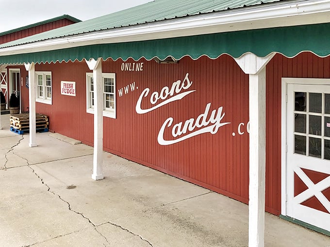 The iconic red exterior of Coons Candy beckons like a barn-sized treasure chest. Even the "FRESH FUDGE" sign seems to whisper sweet promises from across the parking lot.