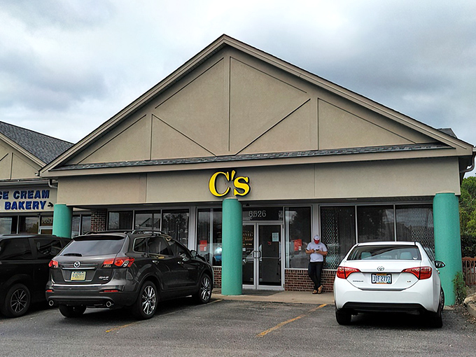 The bright yellow C's Waffles sign stands out like a breakfast beacon, promising morning salvation to hungry Ohioans with its distinctive teal column.
