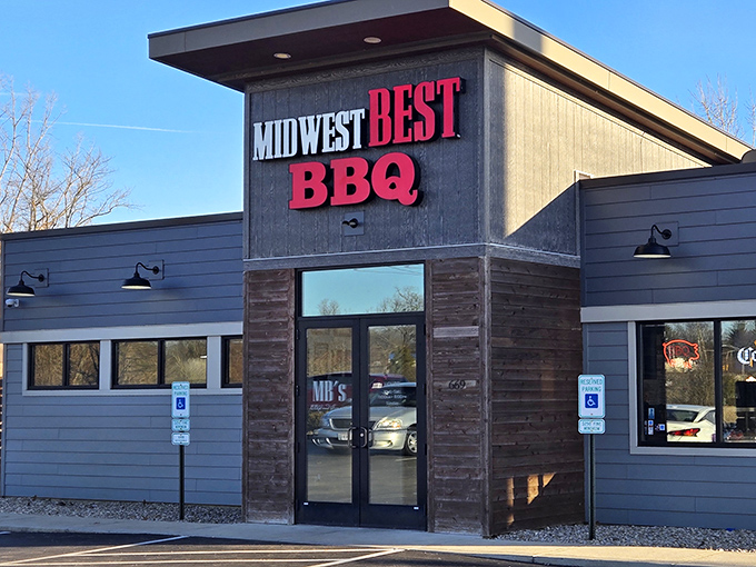 The bold red lettering against dark wood siding isn't just signage&mdash;it's a beacon for barbecue pilgrims seeking smoky salvation in Loveland.