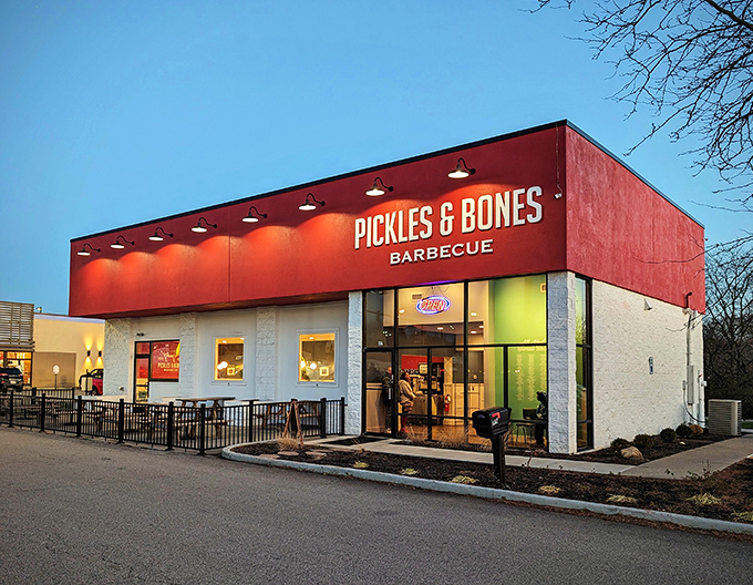 The bright red exterior of Pickles & Bones stands like a beacon of barbecue hope against the Ohio sky. Meat salvation awaits inside.