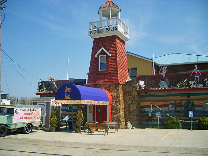 The lighthouse tower stands sentinel at Pickle Bill's, beckoning hungry travelers like a maritime mirage in landlocked Ohio.