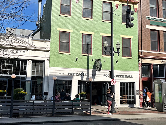 The mint-green facade of The Eagle OTR stands out like a culinary beacon on Vine Street, promising Southern comfort in Cincinnati's historic district.