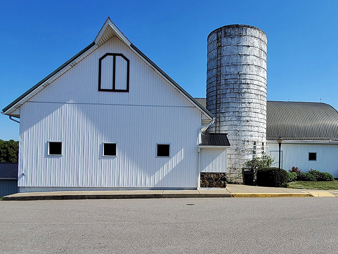 The iconic white barn exterior stands proudly against blue Ohio skies, complete with its towering silo&mdash;a beacon for hungry travelers seeking comfort food paradise.