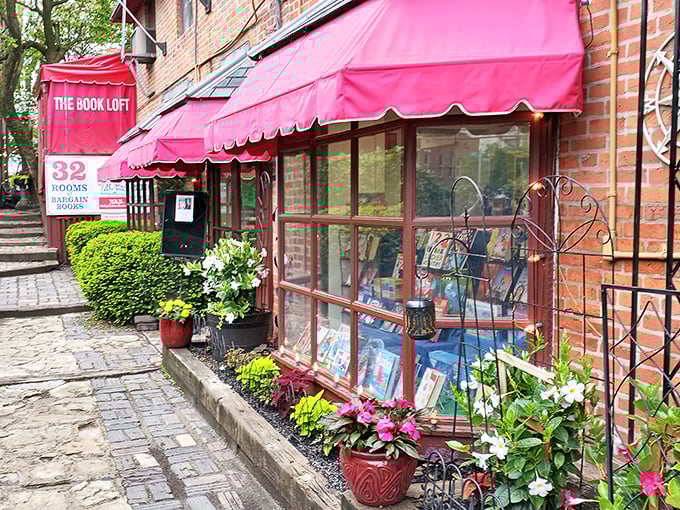 The iconic red awnings of The Book Loft glow like literary beacons at dusk, promising adventures within those brick walls and beckoning bibliophiles from across Ohio.