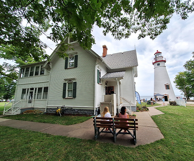 Standing tall since 1821, this gleaming white sentinel with its cherry-red cap has guided sailors through Lake Erie's treacherous waters for two centuries.