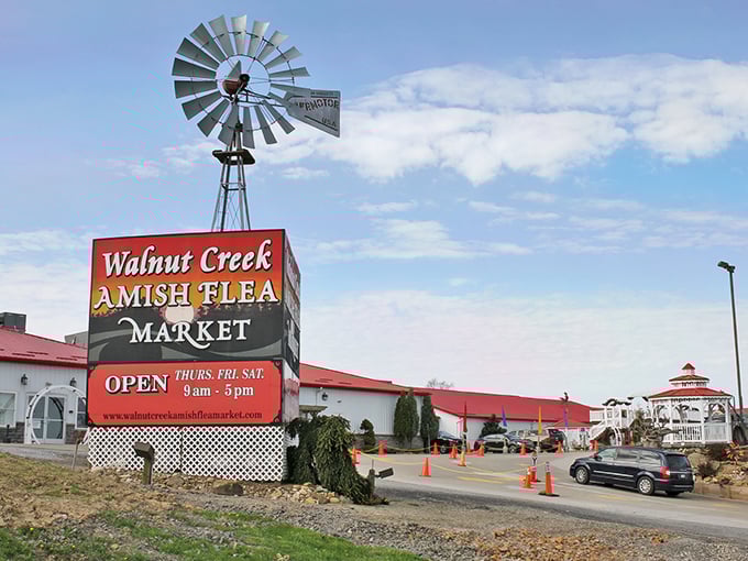 The iconic windmill stands sentinel over Walnut Creek Marketplace, beckoning shoppers like a red-roofed lighthouse for bargain hunters.