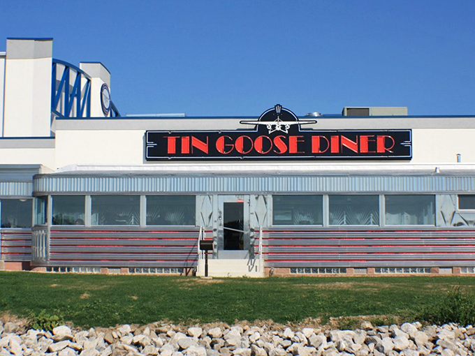The gleaming stainless steel exterior of Tin Goose Diner shines like a beacon of hope for hungry travelers. This isn't just a restaurant&mdash;it's a time machine with pancakes.