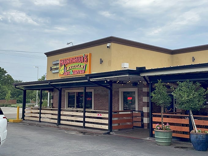 The bright yellow exterior of Tarahumara's stands like a beacon of culinary promise in Norman, beckoning hungry travelers with its distinctive signage and welcoming patio.