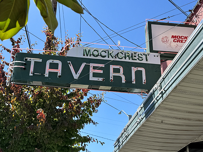 The iconic stone facade and vintage neon sign of Mock Crest Tavern stands as a beacon for breakfast seekers in North Portland.