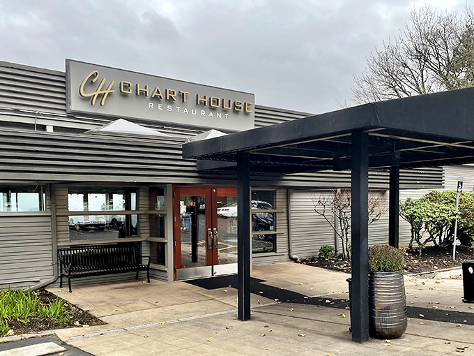 The Chart House exterior welcomes you with its distinctive horizontal stripes and stone accents&mdash;like a mid-century modern postcard that promises good times and better meals inside. 