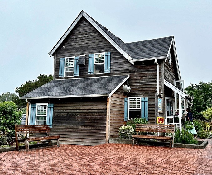 The storybook charm of this weathered cedar cottage promises breakfast magic before you even step inside.