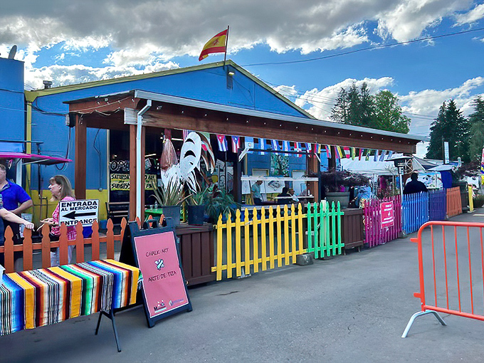 The vibrant blue exterior of M&M Marketplace stands out like a beacon of bargain-hunting hope, complete with cheerful yellow accents that promise colorful discoveries inside.