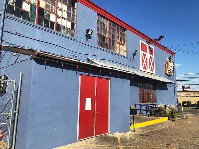 The unassuming blue exterior with barn-red accents is like a barbecue speakeasy&mdash;those in the know recognize this humble building houses smoky treasures within.