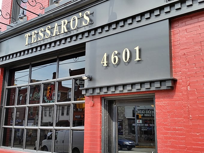 The brick-red facade of Tessaro's stands like a beacon of burger hope on Liberty Avenue, promising carnivorous delights within those historic walls.