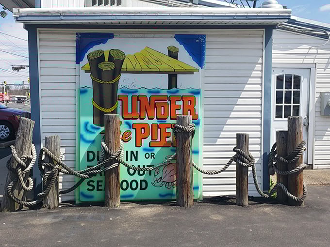 The nautical entrance to Under the Pier looks like a movie set&mdash;wooden posts, rope barriers, and a vibrant hand-painted sign that practically shouts "fresh seafood inside!"