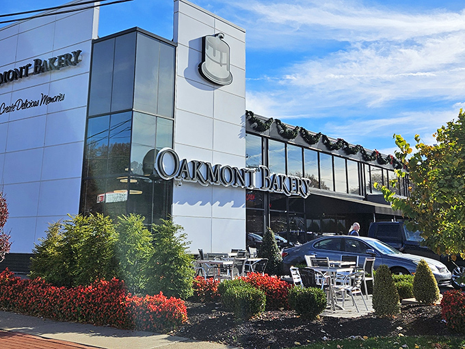 The iconic Oakmont Bakery sign stands like a beacon of hope for the sugar-deprived. This modern temple of temptation promises sweet salvation inside.