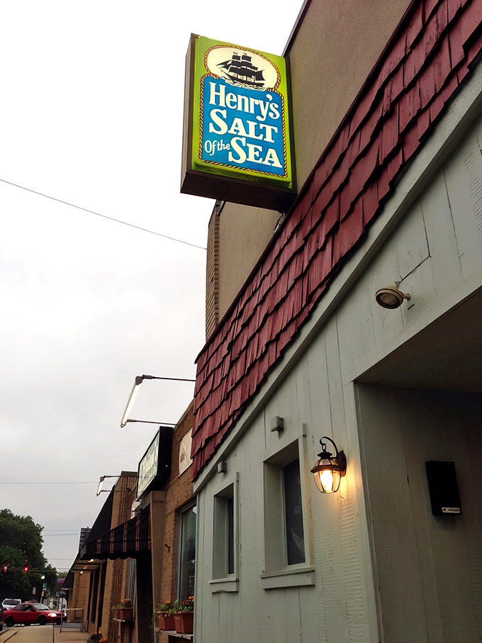 The unassuming exterior of Henry's Salt of the Sea stands like a culinary speakeasy, hiding treasures that locals have sworn by for decades.