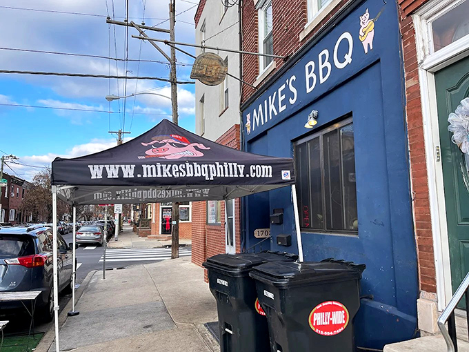 The blue storefront beckons like a barbecue lighthouse on South 11th Street, promising smoky salvation to all who enter.