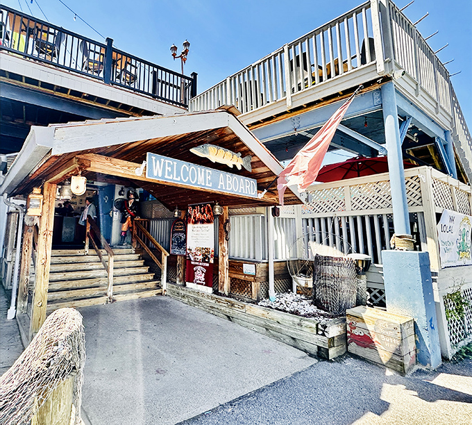 The iconic lighthouse exterior of Cooper's Seafood House stands like a beacon for hungry travelers. Nautical flags flutter above, promising seafood treasures within.