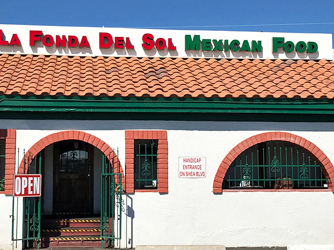 The classic white stucco, red brick arches, and clay tile roof aren't just Southwestern charm—they're a beacon calling hungry travelers from across Arizona.