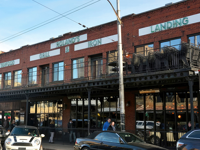 The iconic brick fa&ccedil;ade of Roland's stands proudly in Pittsburgh's Strip District, its neon-green signage promising oceanic delights in the heart of steel country.