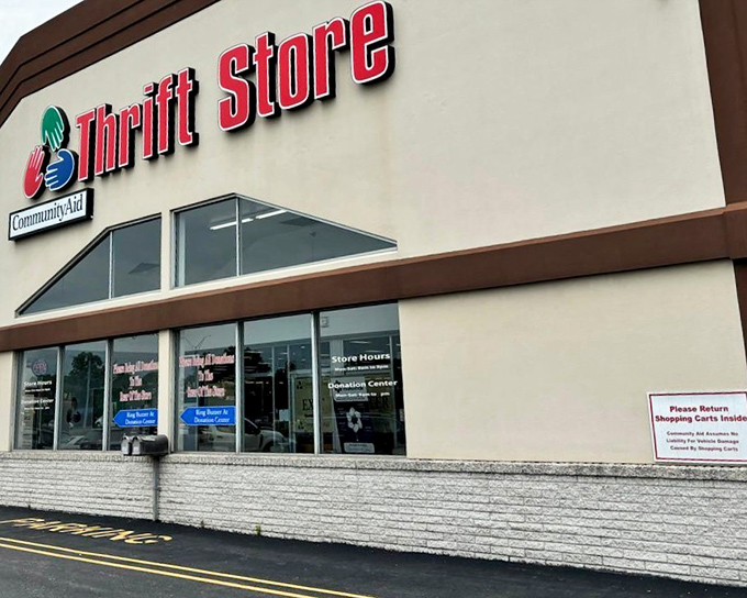 The red signage beckons like a lighthouse to bargain hunters. CommunityAid's exterior promises treasure hunting adventures within those unassuming walls.