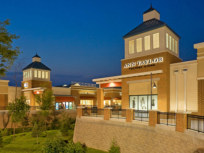 The architectural charm of Philadelphia Premium Outlets glows at twilight, with Ann Taylor's inviting storefront beckoning shoppers like a retail lighthouse in a sea of deals.