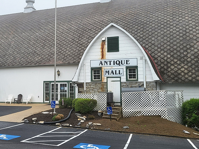 The iconic barn-shaped exterior of Crossroads Antique Mall stands like a beacon for treasure hunters in Hershey, promising adventures in time travel without the flux capacitor.