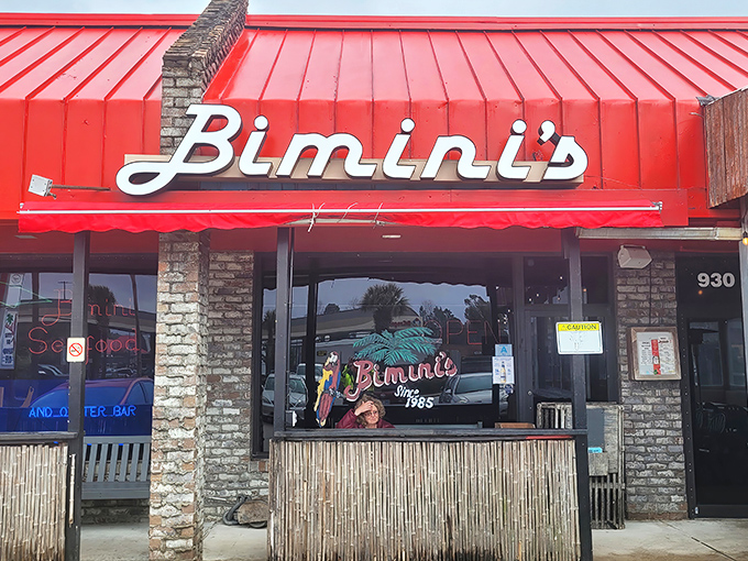 The iconic red roof and awning of Bimini's stands as a beacon for seafood lovers. No fancy frills needed when the food speaks this loudly.