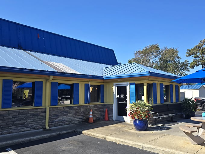 The bright blue roof and cheerful yellow walls of Johnny D's beckon like a breakfast lighthouse, promising delicious refuge from ordinary morning meals.