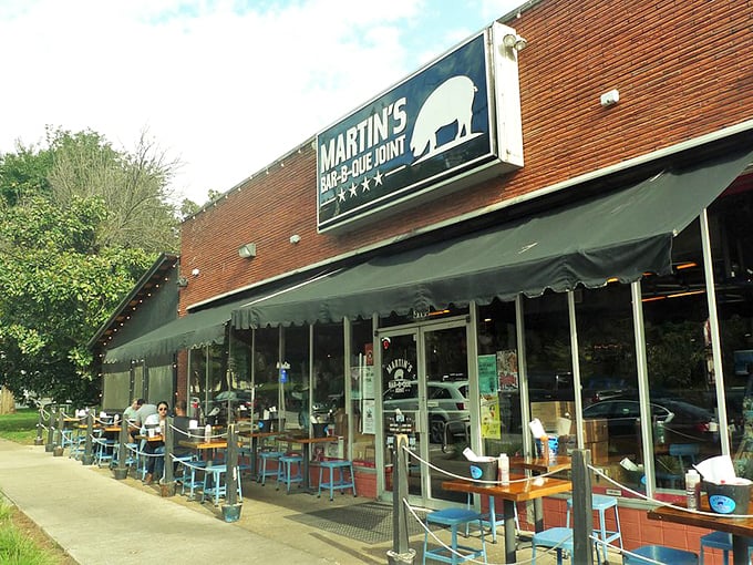 The red brick exterior of Martin's Bar-B-Que Joint beckons hungry pilgrims with its no-nonsense fa&ccedil;ade and the promise of smoky delights within.