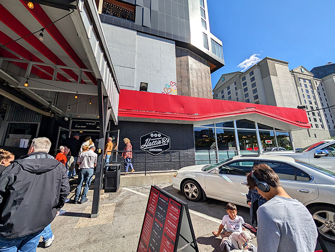 The iconic red glow of Hattie B's beckons hungry pilgrims like a Nashville neon lighthouse. Even at dusk, the line forms for that crispy, spicy salvation. 