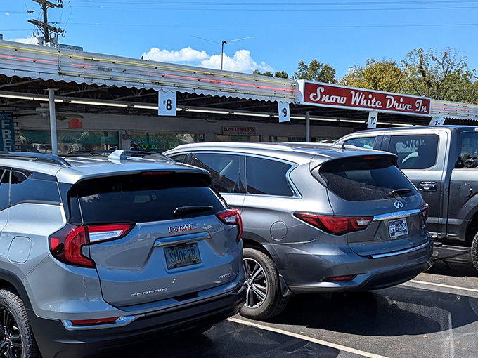 The iconic red signage of Snow White Drive In beckons hungry travelers like a culinary lighthouse in Lebanon's sea of chain restaurants.