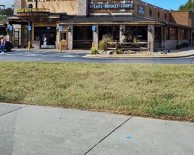 The rustic brick-and-wood exterior of Fort Worth Steakhouse promises authentic Texas flavor without pretense. Meat paradise awaits beyond those doors.