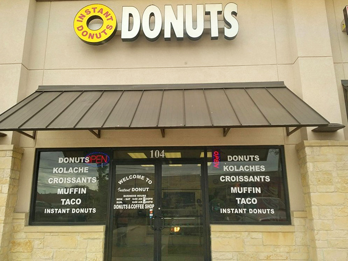 The unassuming storefront of Instant Donuts stands like a beacon of hope for carb enthusiasts. No fancy frills, just the promise of delicious donuts waiting inside.
