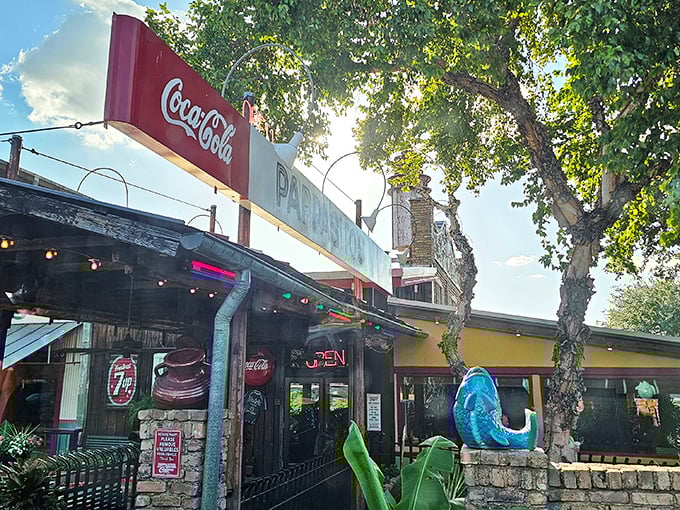 Pappasito's neon-lit exterior glows like a Tex-Mex lighthouse, beckoning hungry travelers with its colorful charm and promise of culinary adventure.
