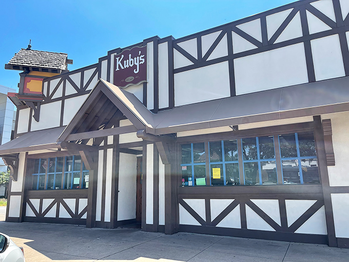 The Tudor-style facade of Kuby's stands like a Bavarian time machine in Dallas, complete with a charming clock tower that seems to whisper "time for schnitzel!"