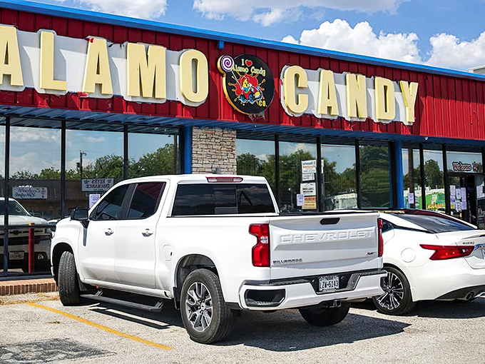 The vibrant red storefront of Alamo Candy Company stands out like a sugar rush waiting to happen. Sweet dreams are made of this!