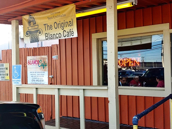 The unassuming orange exterior of Blanco Cafe stands like a humble guardian of culinary treasures. No fancy frills, just the promise of authentic Tex-Mex magic inside.