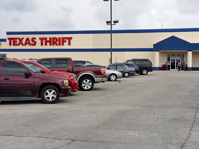 The blue and red exterior of Texas Thrift stands like a beacon of bargain possibilities, promising treasure hunts that won't break the bank.