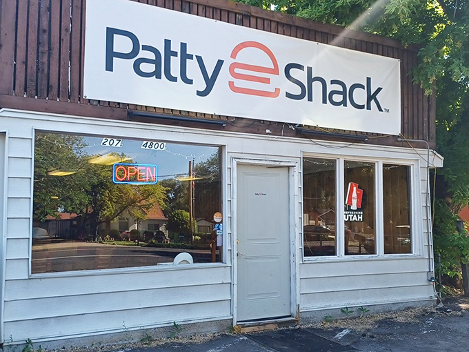 The classic white exterior with that vintage sign promises no-frills perfection. That red Thunderbird knows what's up. 