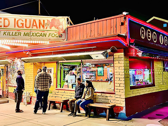 The neon glow of Red Iguana's iconic sign beckons hungry pilgrims like a lighthouse for those lost in a sea of mediocre Mexican food.
