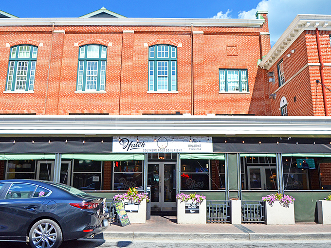The brick fa&ccedil;ade of The Hatch stands proudly in downtown Roanoke, a culinary beacon with its welcoming green trim and flower boxes that whisper, "Come hungry, leave happy."