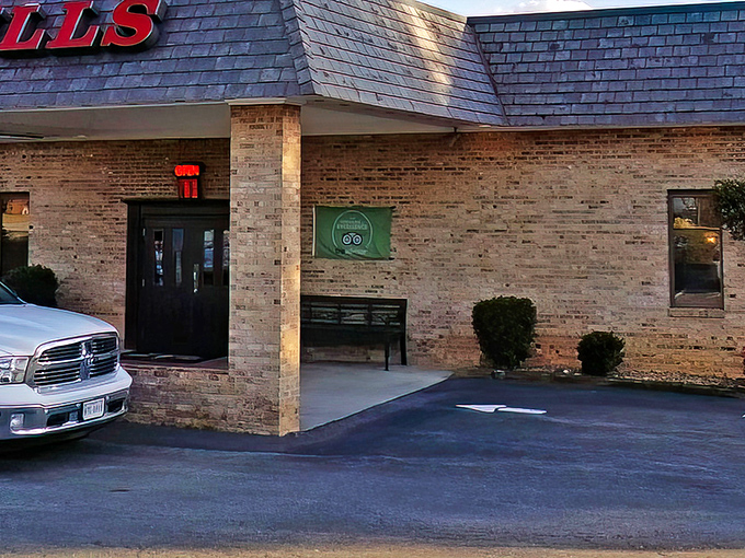 The unassuming brick exterior of Bulls Steakhouse proves once again that the most memorable meals often hide behind the most modest facades.