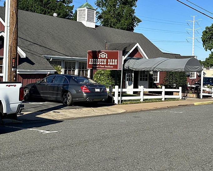The red barn exterior isn't just charming architecture&mdash;it's a promise of carnivorous delights waiting inside. Like a beacon for beef lovers on Emmet Street.