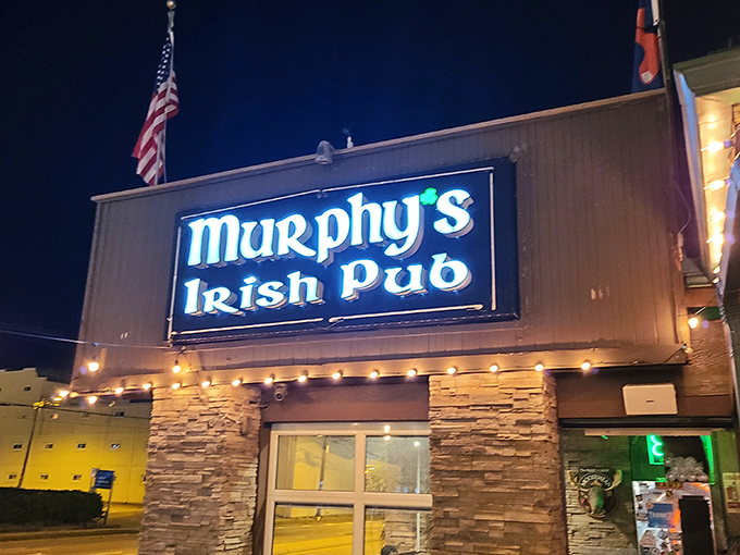 Murphy's Irish Pub beckons with stone facade charm and twinkling lights that promise authentic craic inside.